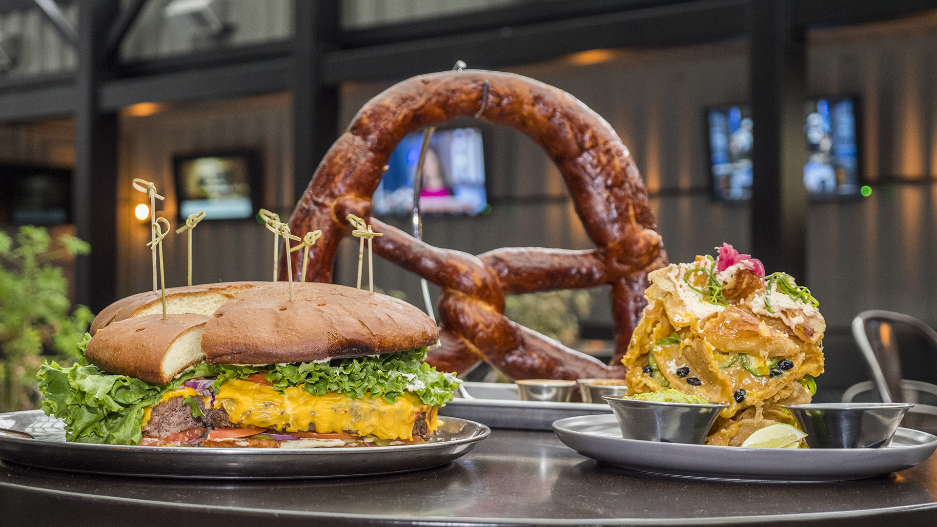 Rizzo's Gets Gluttonous with a Supersized Burger, Pretzel, and Trash ...